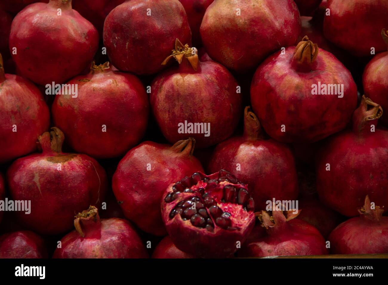 Red pomegranates and seeds in the shell Stock Photo - Alamy