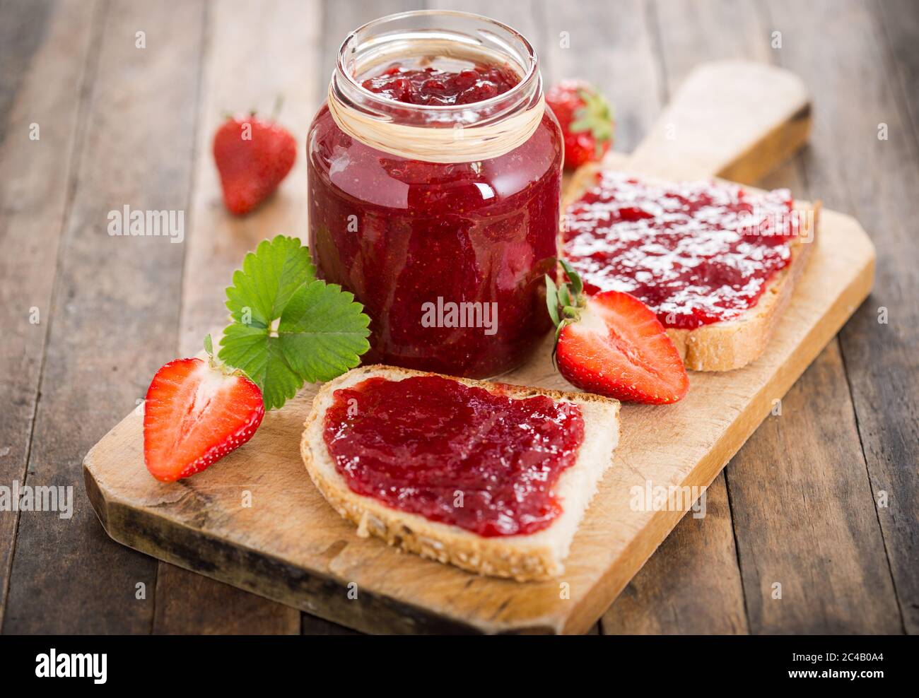 Strawberry jam on the bread Stock Photo - Alamy