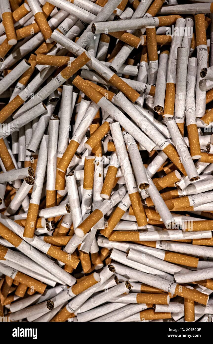 Loose rejected cigarettes vertical image Stock Photo - Alamy