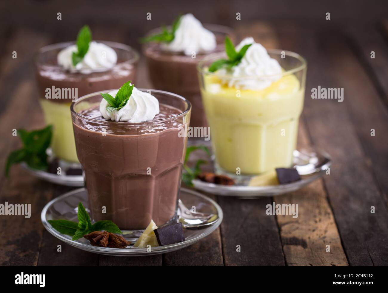 Chocolate and vanilla pudding with whipped cream Stock Photo - Alamy