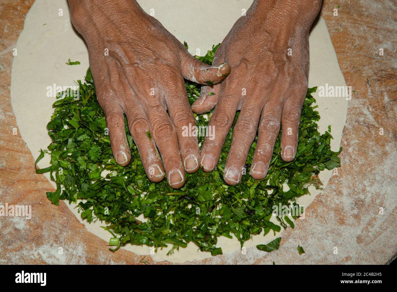 Making traditional caucasian herbal kutab Stock Photo - Alamy