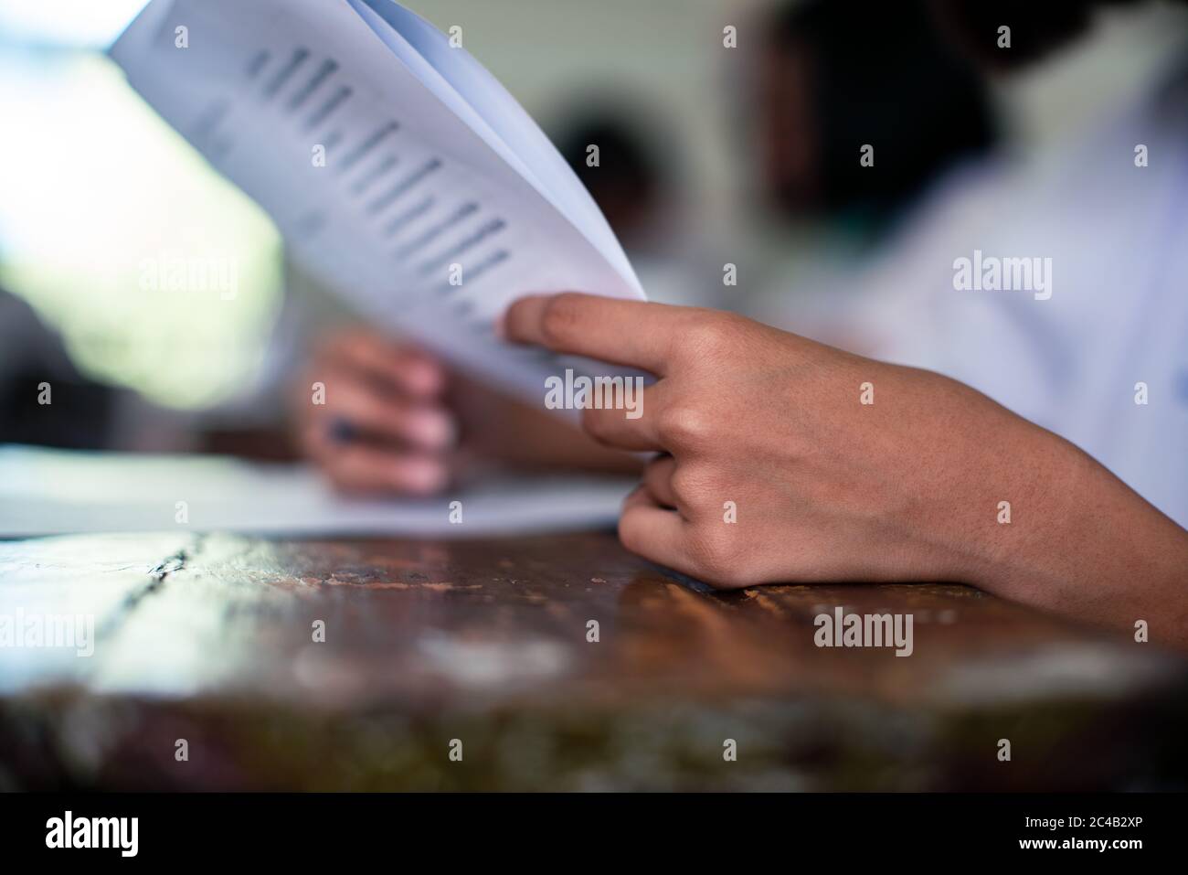 Students doing exam answer sheets exercises in classroom of school ...