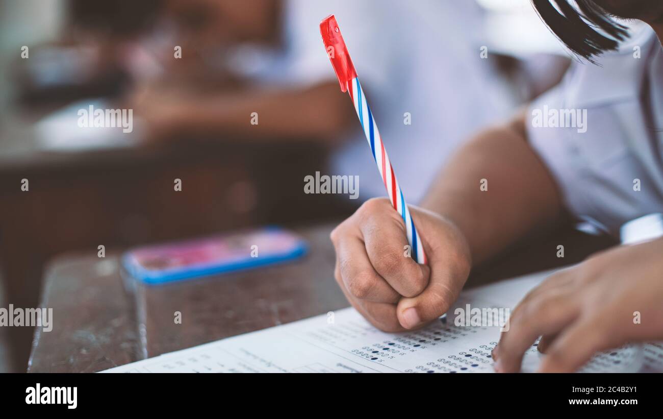 Students doing exam answer sheets exercises in classroom of school.16:9 ...