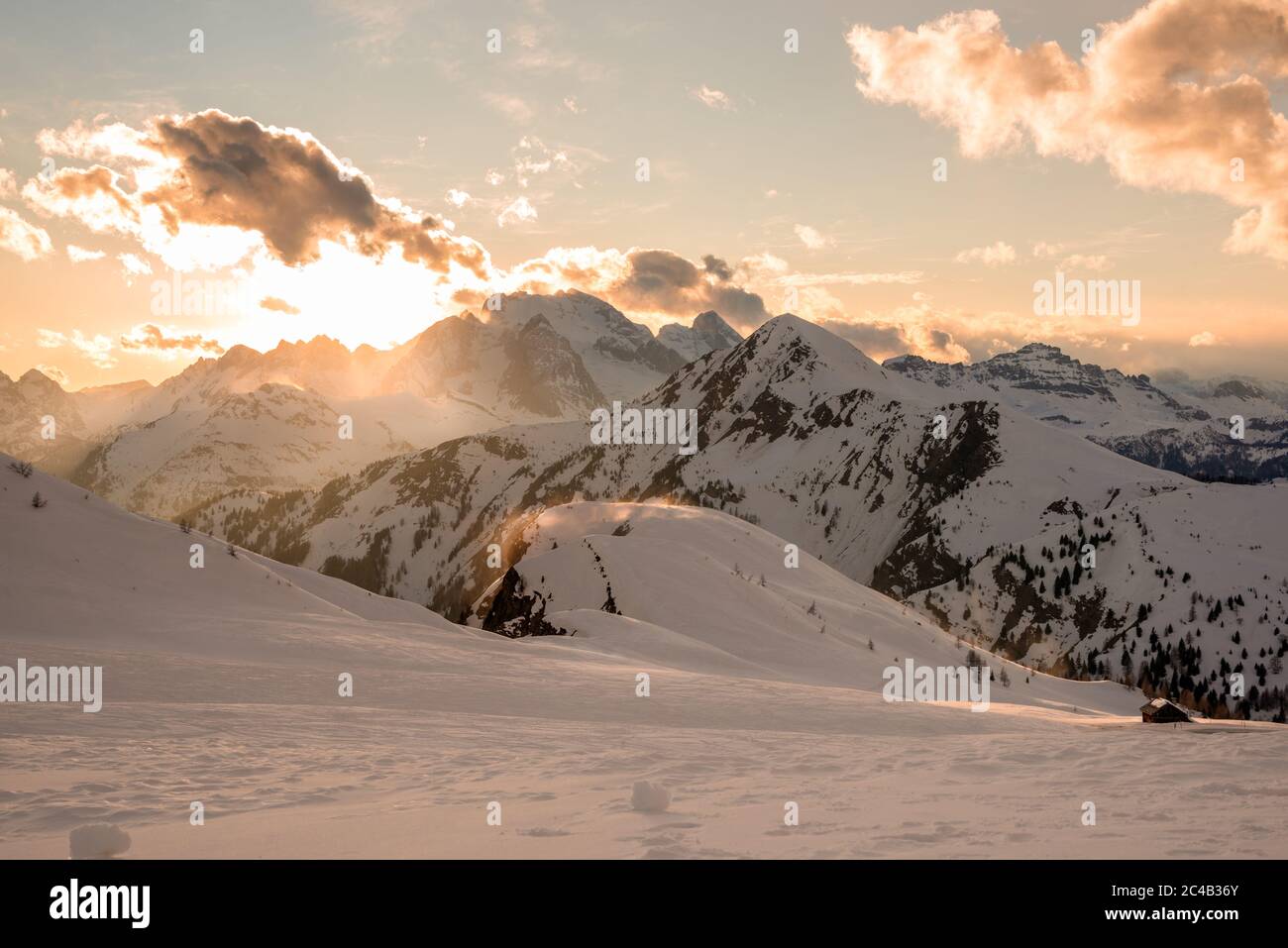 Sunset over majestic snowy peaks in the European Alps in winter Stock ...