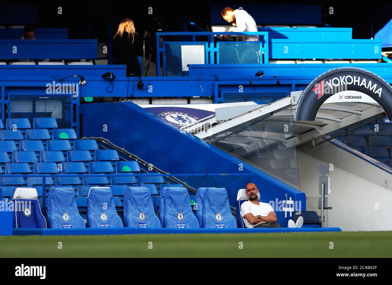 Manchester City manager Pep Guardiola on the bench before the Premier ...