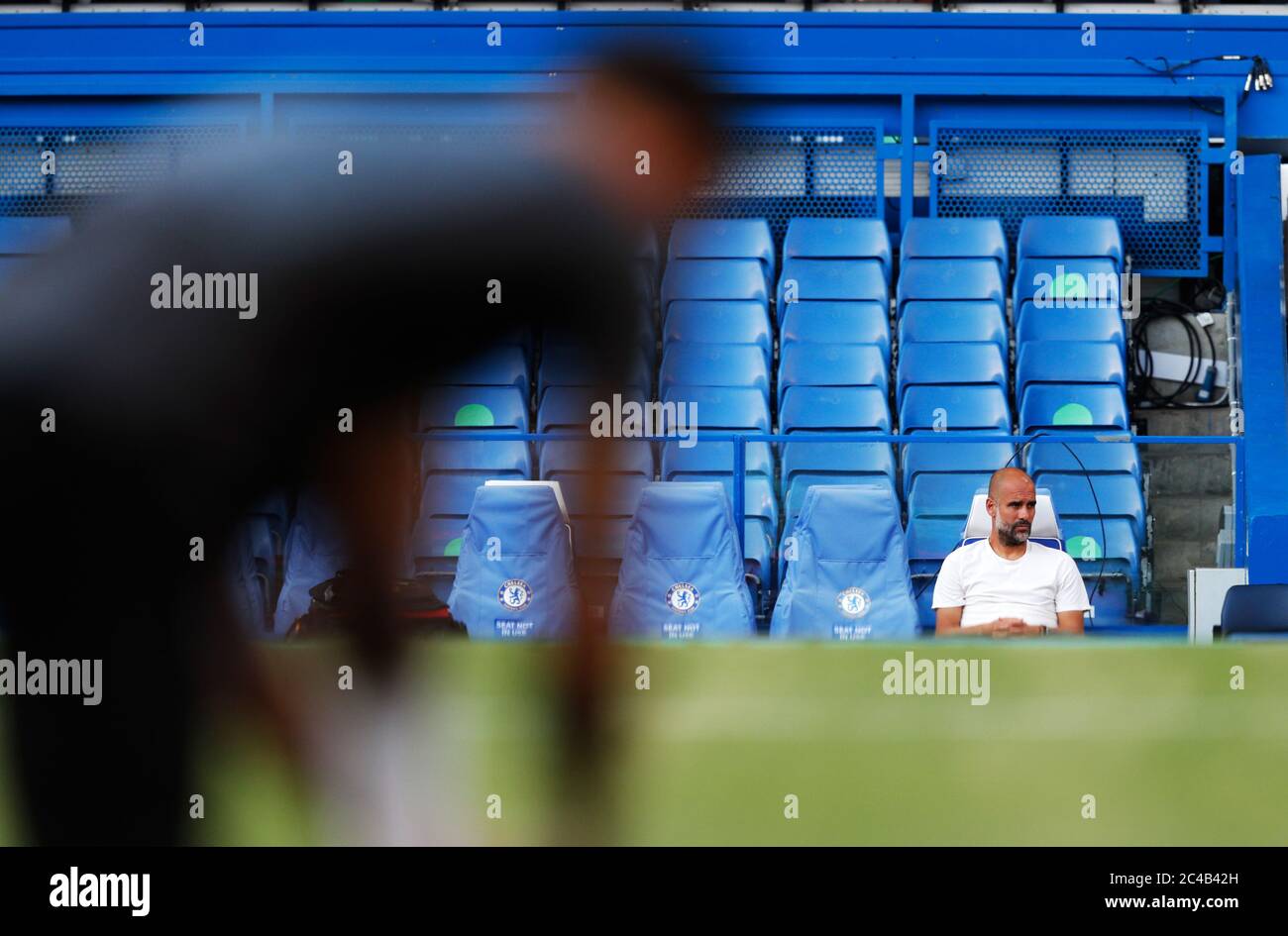 Manchester City manager Pep Guardiola on the bench before the Premier ...