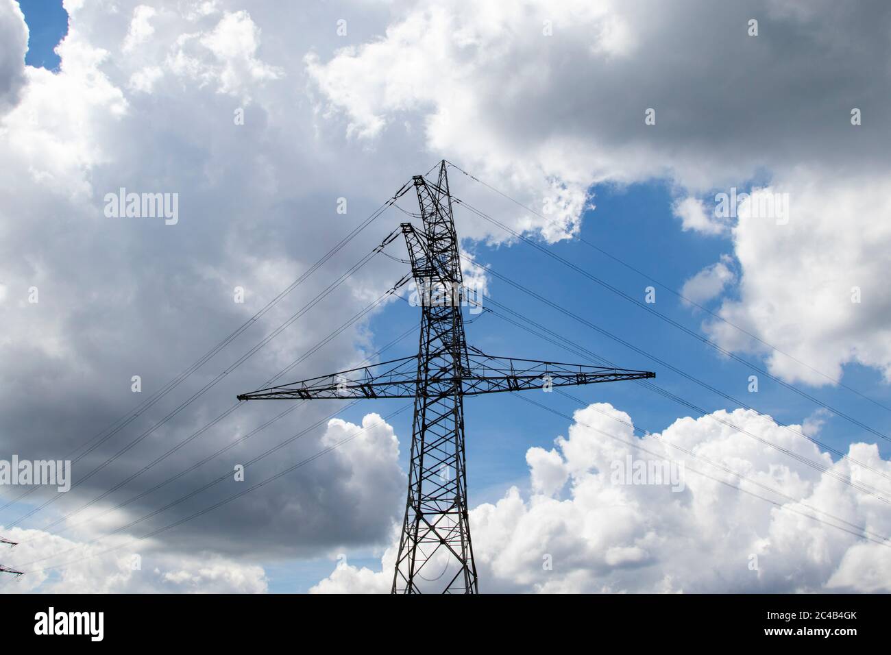 power pylon with power wires with blue sky as background, outdoors ...