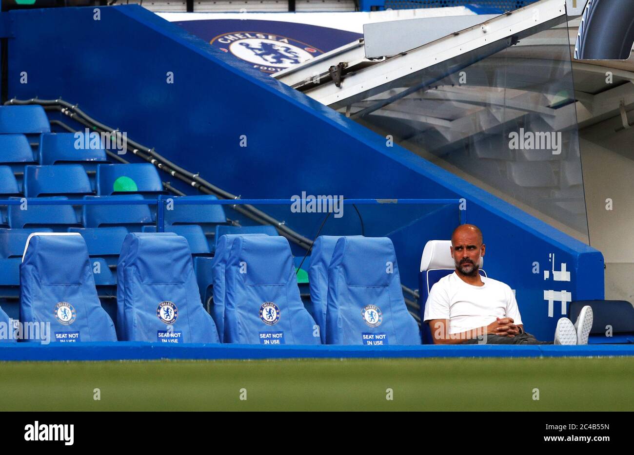 Manchester City manager Pep Guardiola on the bench before the Premier ...