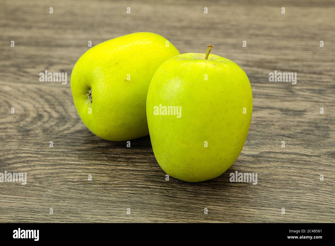 Two ripe green sweet tasty apples Stock Photo - Alamy