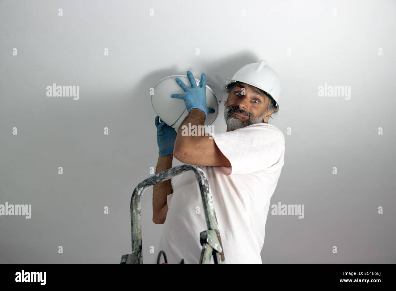 Installing lamp on ceiling hi-res stock photography and images - Alamy
