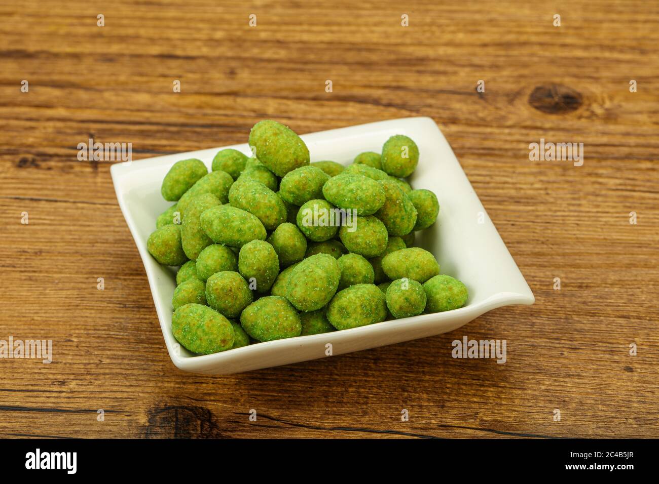 Spicy wasabi peanuts snack in the bowl Stock Photo - Alamy