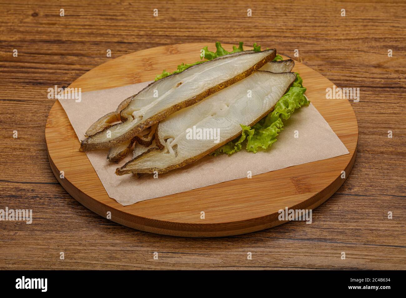 Delicous smoked halibut fish slices snack Stock Photo - Alamy