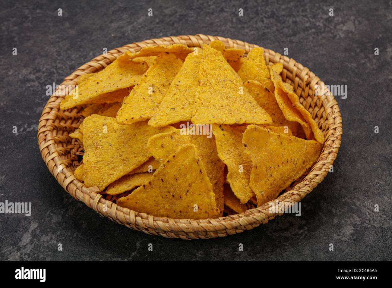 Mexican crunchy corn nachos triangle heap Stock Photo - Alamy