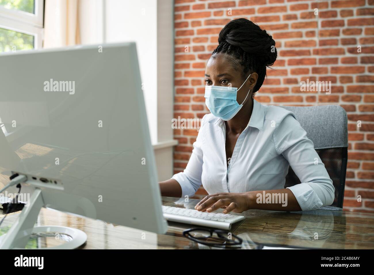 Professional African Woman Business Employee Typing In Office Stock ...