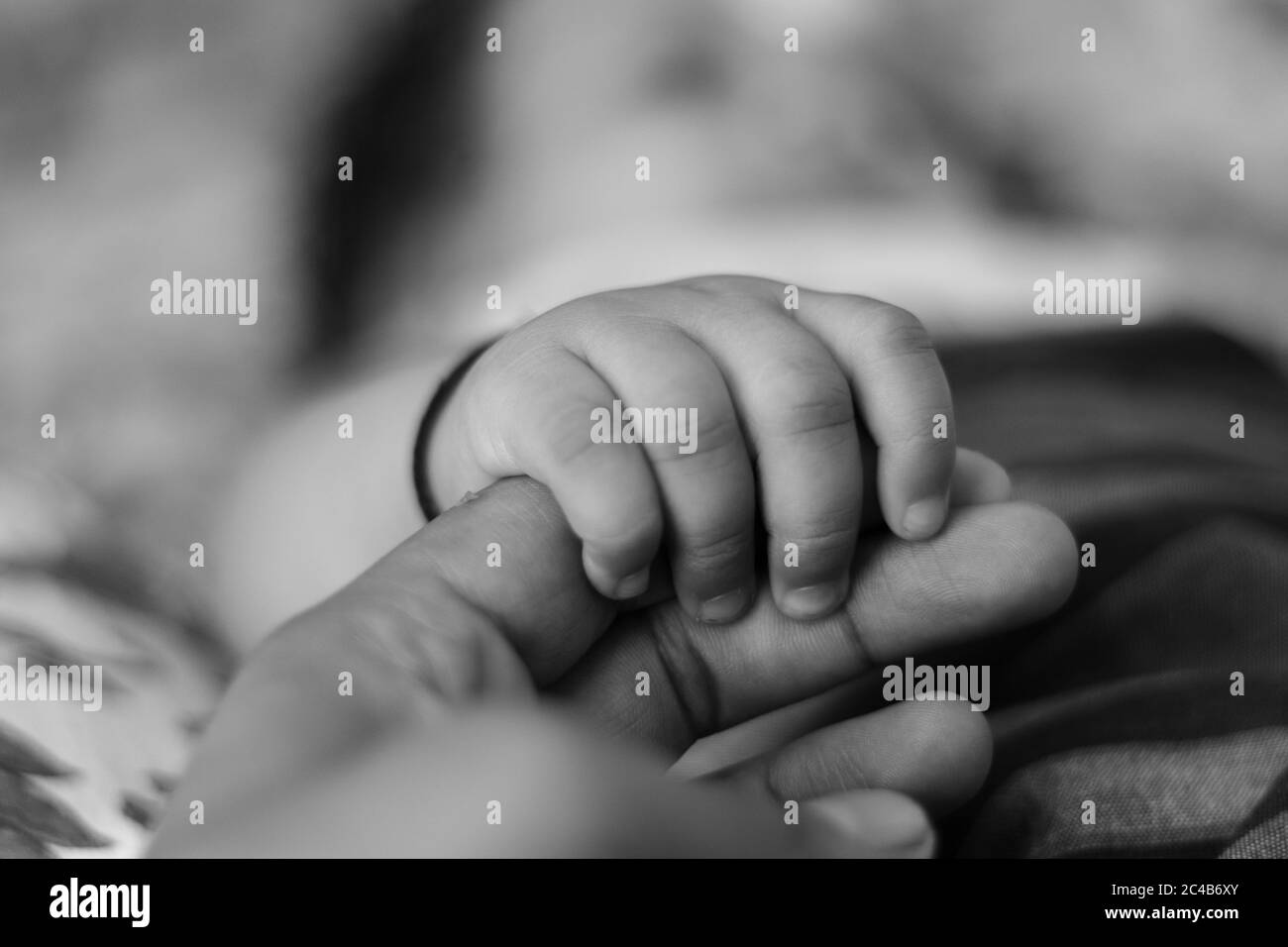 Infant baby body parts in black and white composition Stock Photo - Alamy