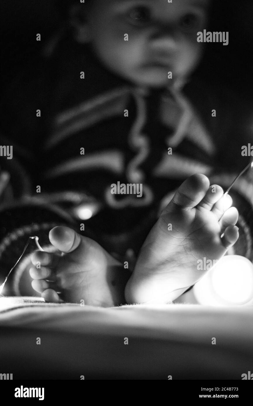 Infant baby body parts in black and white composition Stock Photo - Alamy