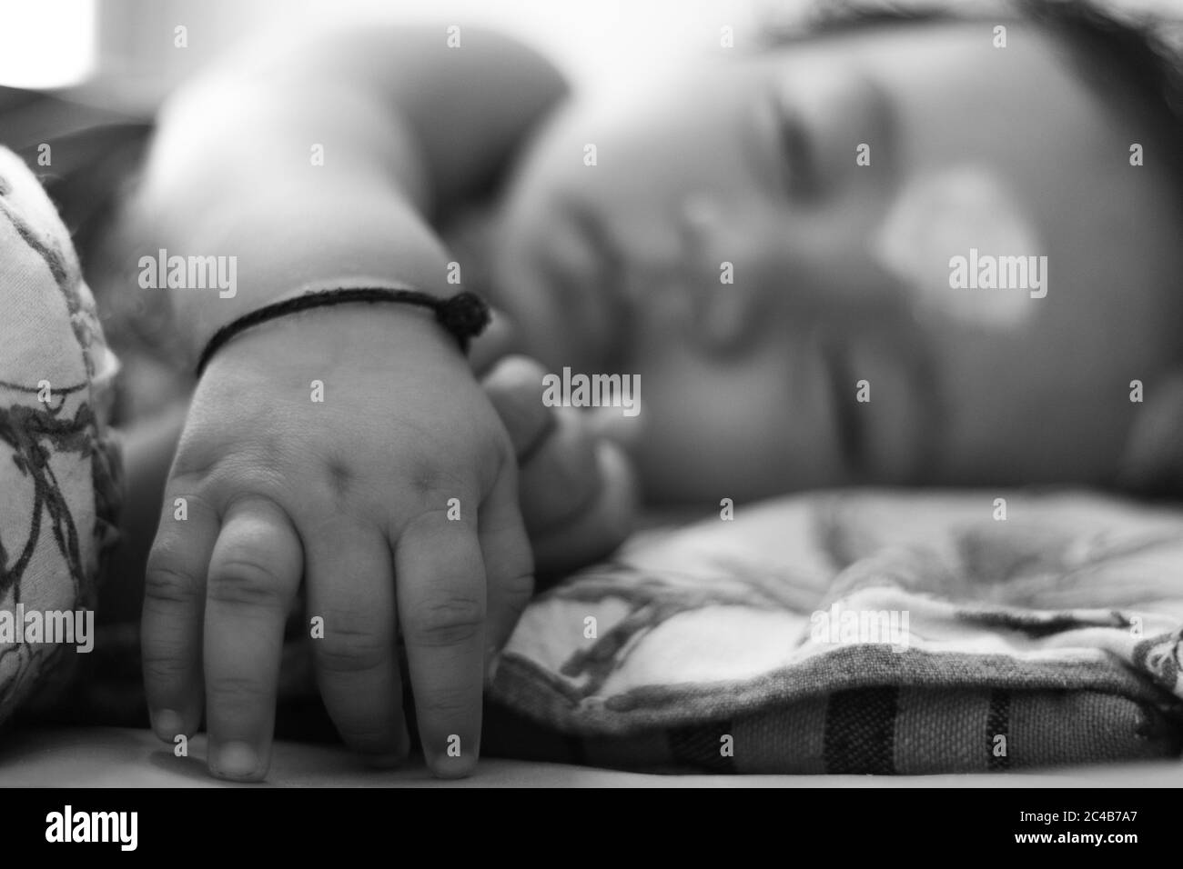 Infant baby body parts in black and white composition Stock Photo - Alamy