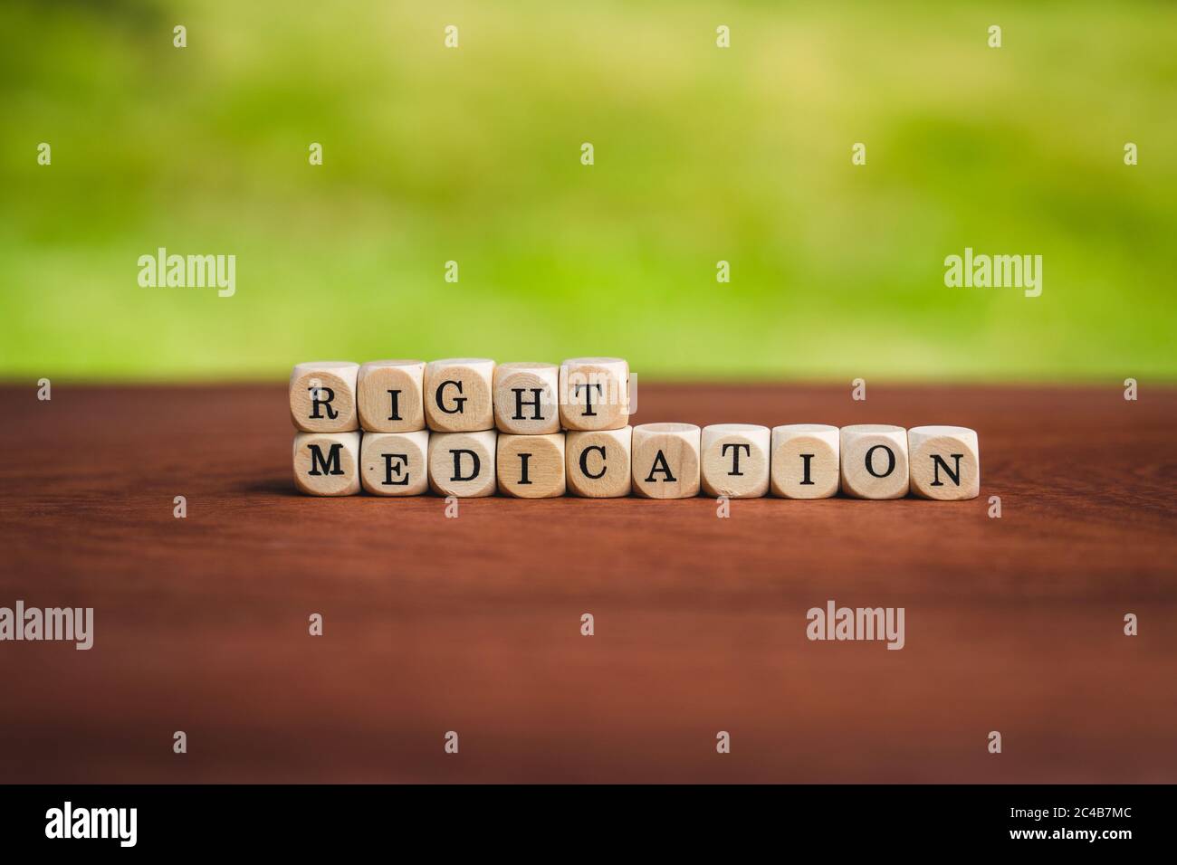 Closeup of isolated dices on a table showing the words right medication ...