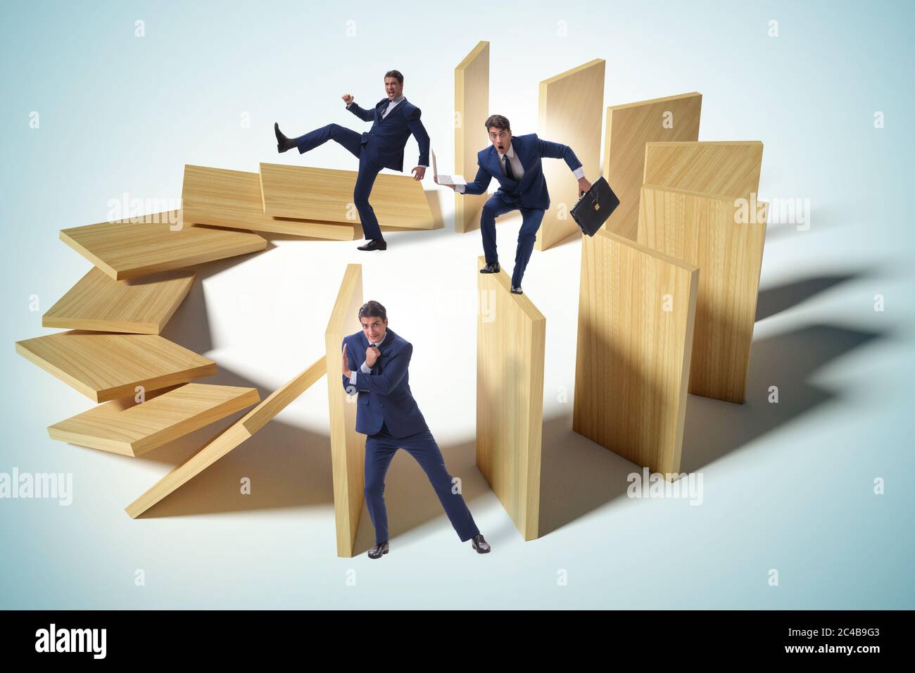 Domino effect and the competition concept Stock Photo - Alamy