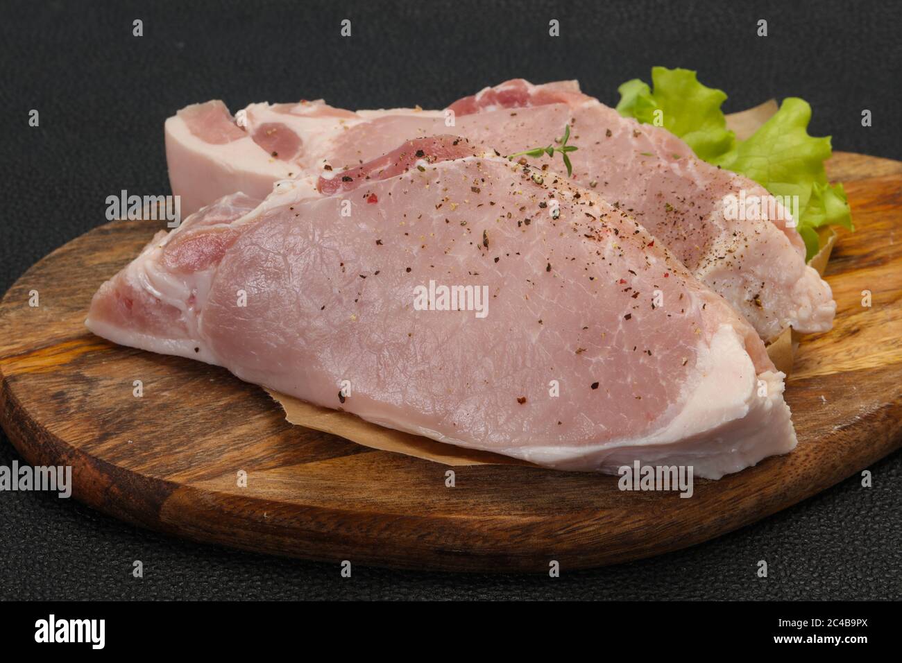 Raw pork meat steak ready for grill Stock Photo - Alamy