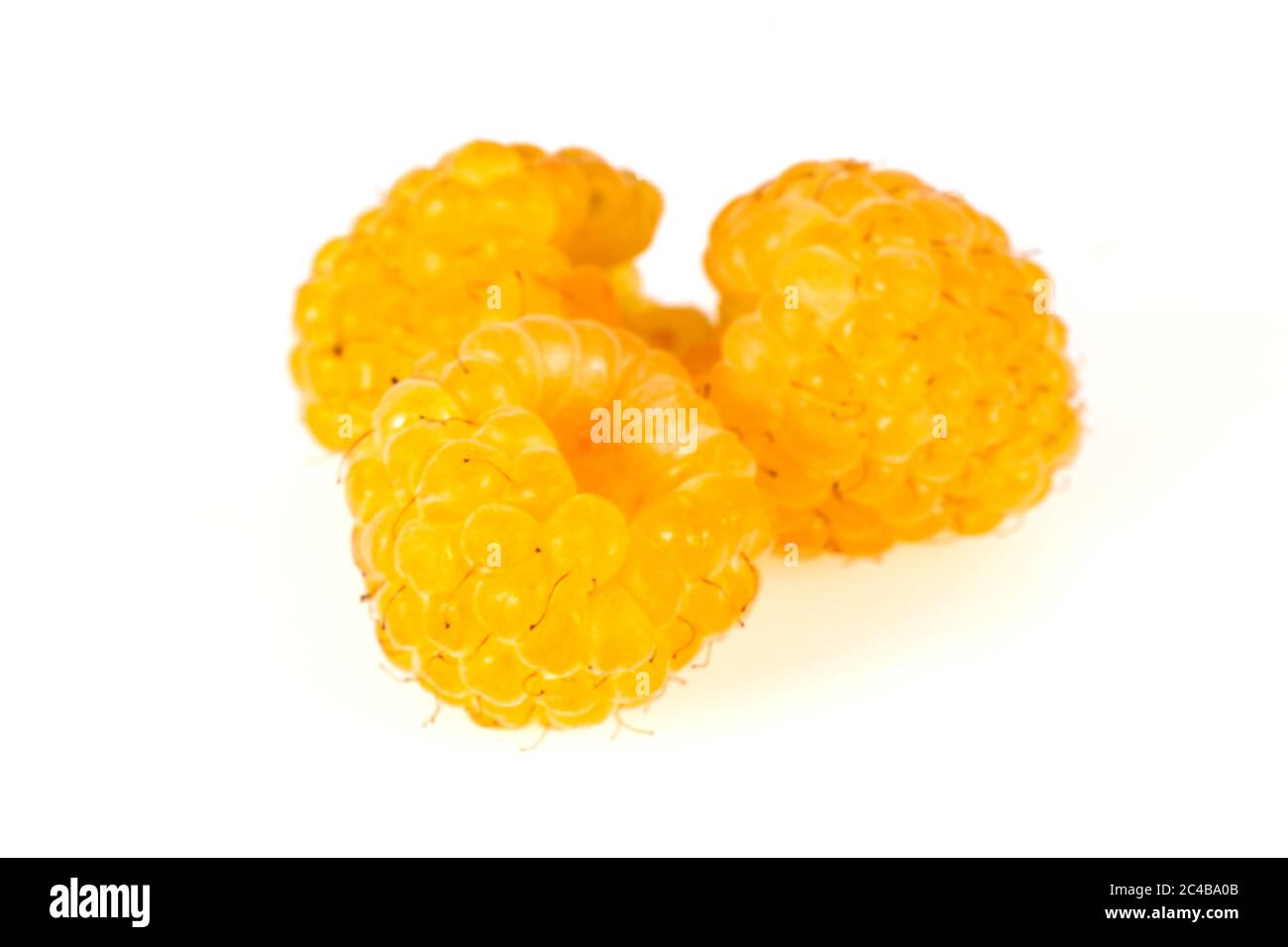 Sweet ripe tasty yellow raspberry with leaf Stock Photo - Alamy