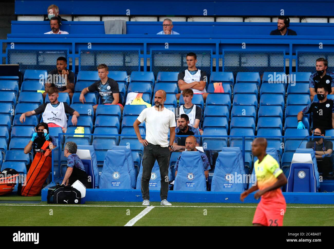 Manchester City manager Pep Guardiola (centre) on the touchline during ...