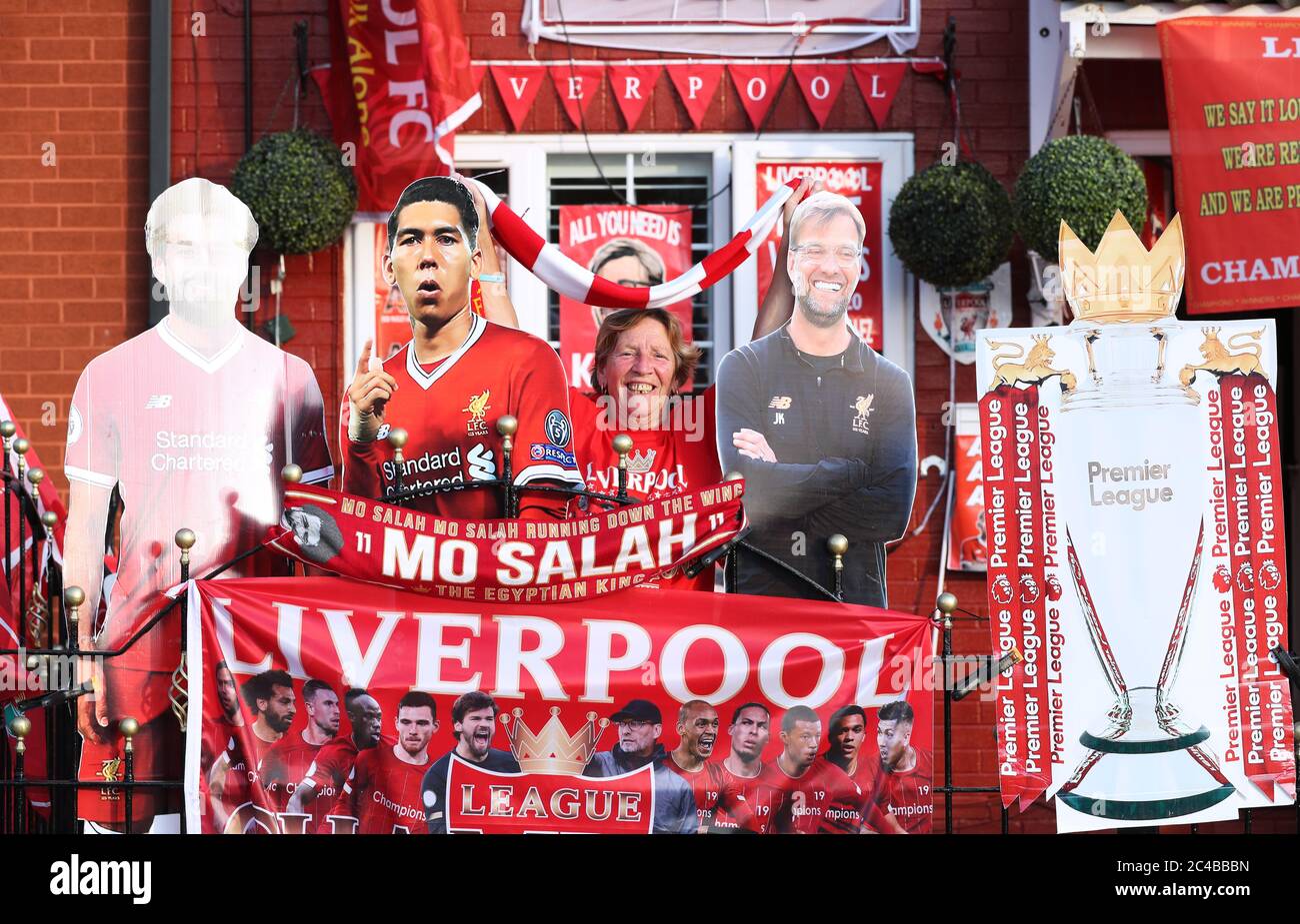 Liverpool fan Emily Farley poses for a photo outside her home in ...