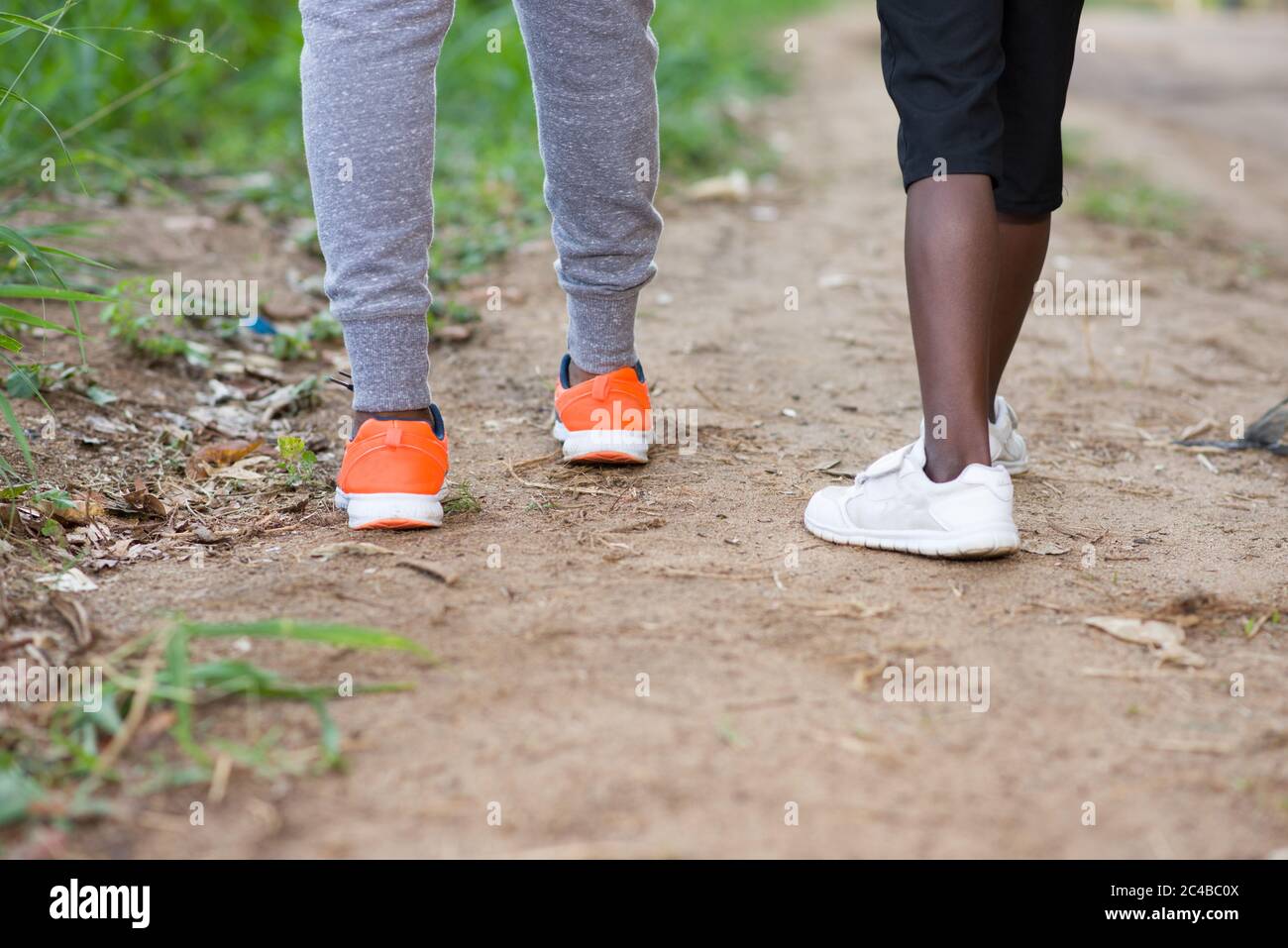 shoes worn by girl and boy Stock Photo - Alamy