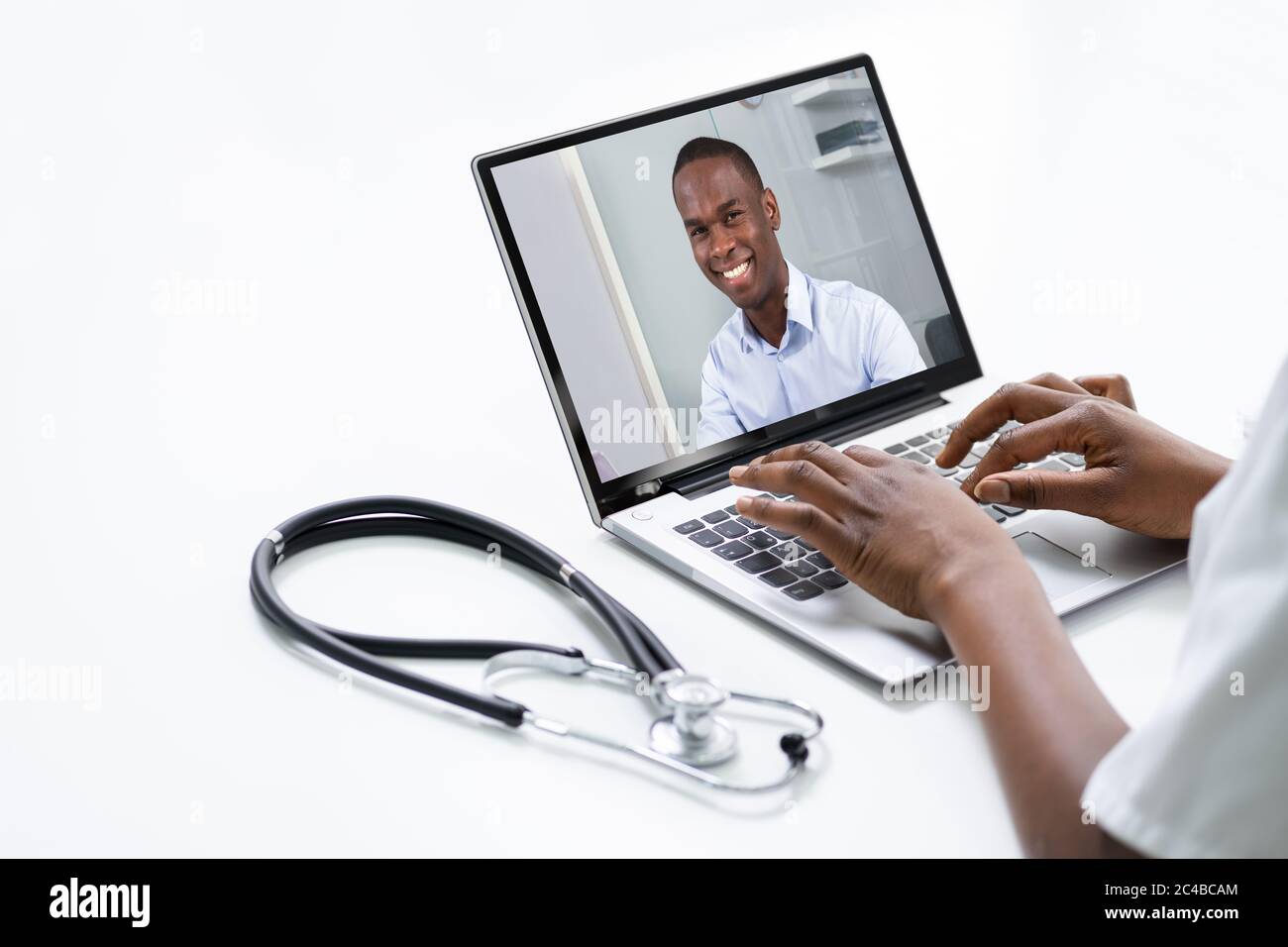 African Doctor In Video Conference Call Talking With Patient Stock ...