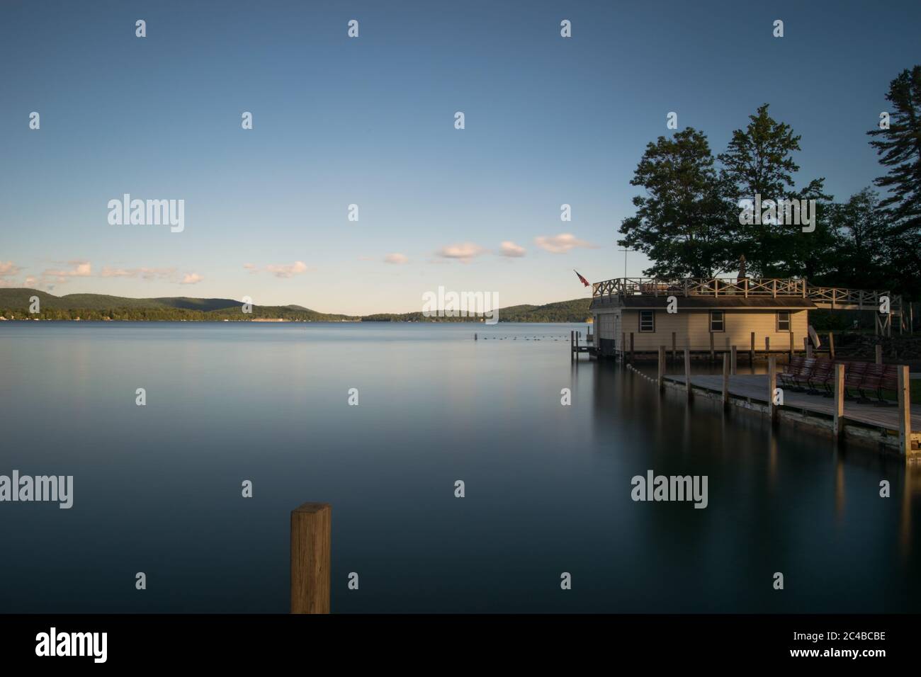 Dock overlooking water blue sky hi-res stock photography and images - Alamy