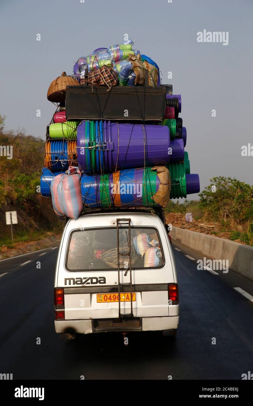 Overloaded minibus on a road in togo Stock Photo - Alamy