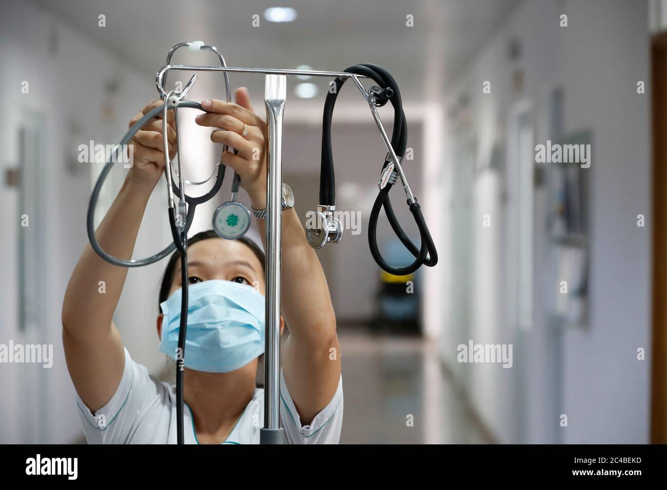 Hospital doctor with stethoscope Stock Photo - Alamy