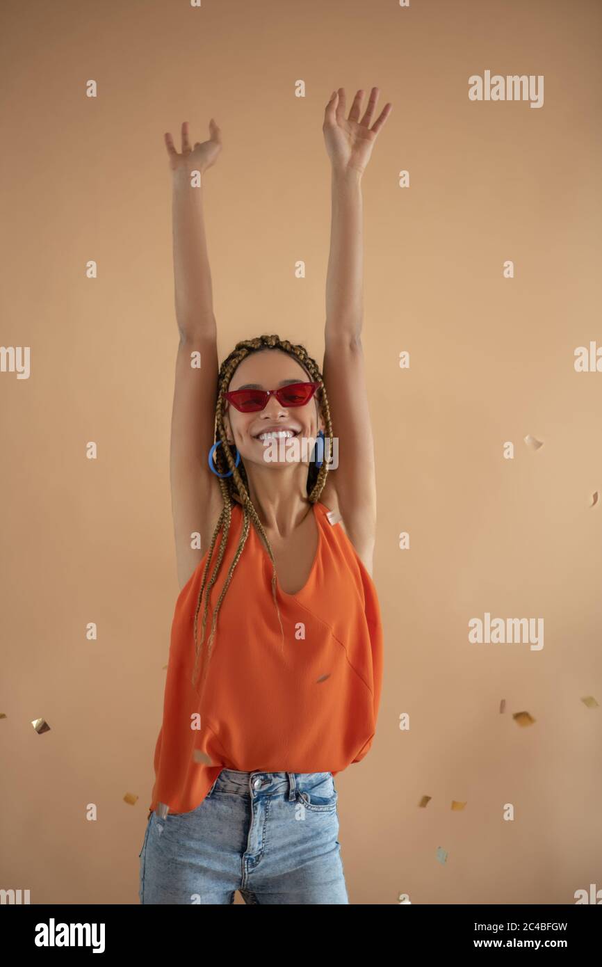 Woman raising hands above head hi-res stock photography and images - Alamy