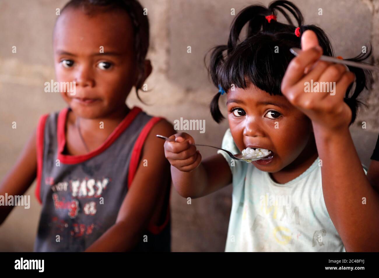 Free food distribution for street children Stock Photo - Alamy