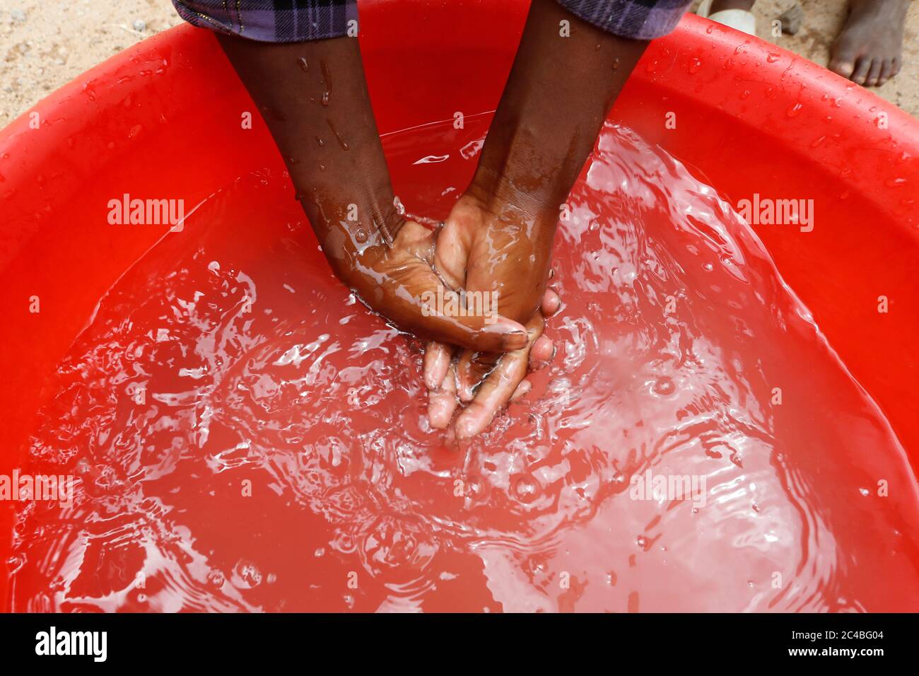 Free food distribution for street children Stock Photo - Alamy