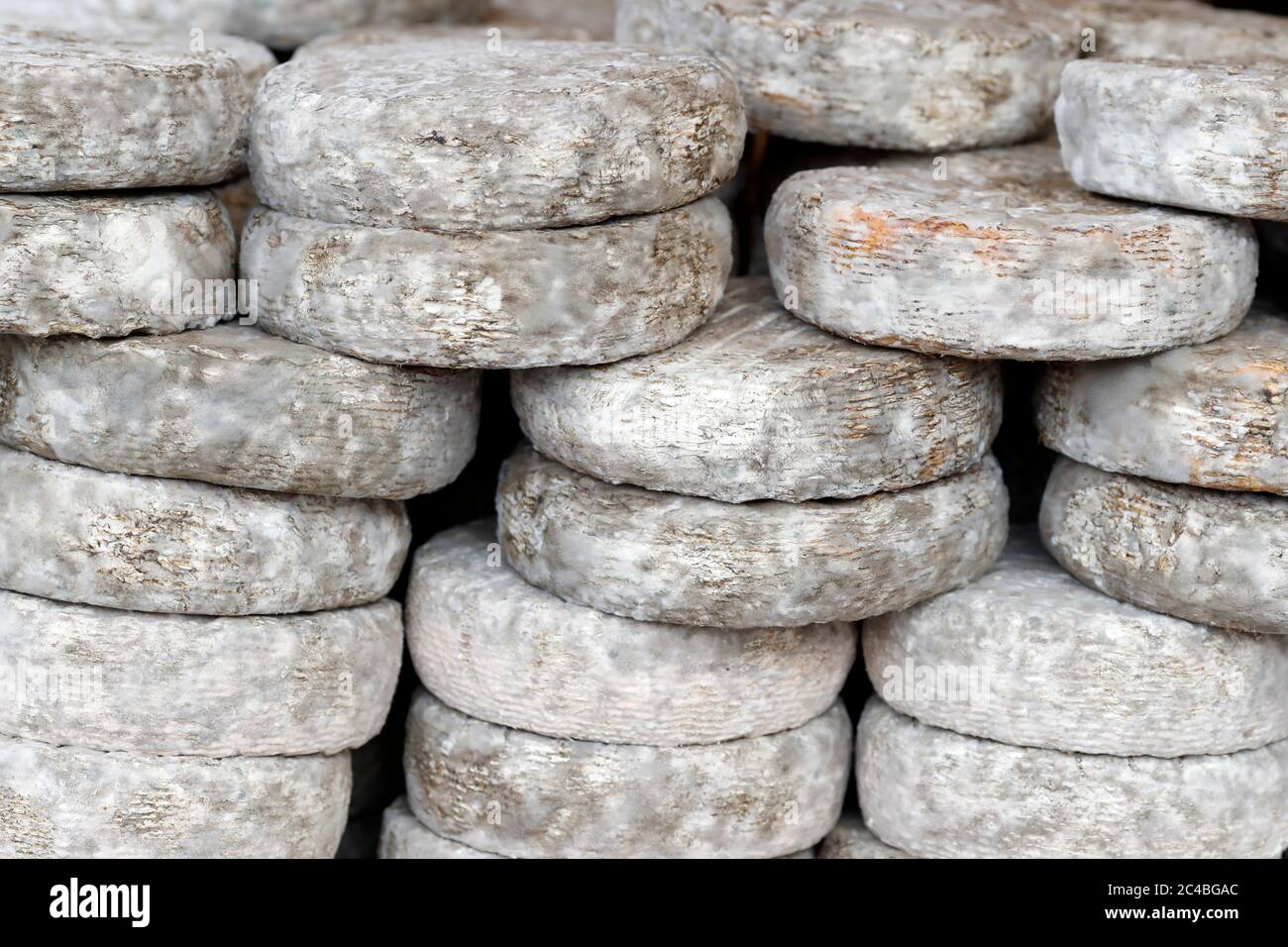 Traditional french cheese for sale at market Stock Photo - Alamy