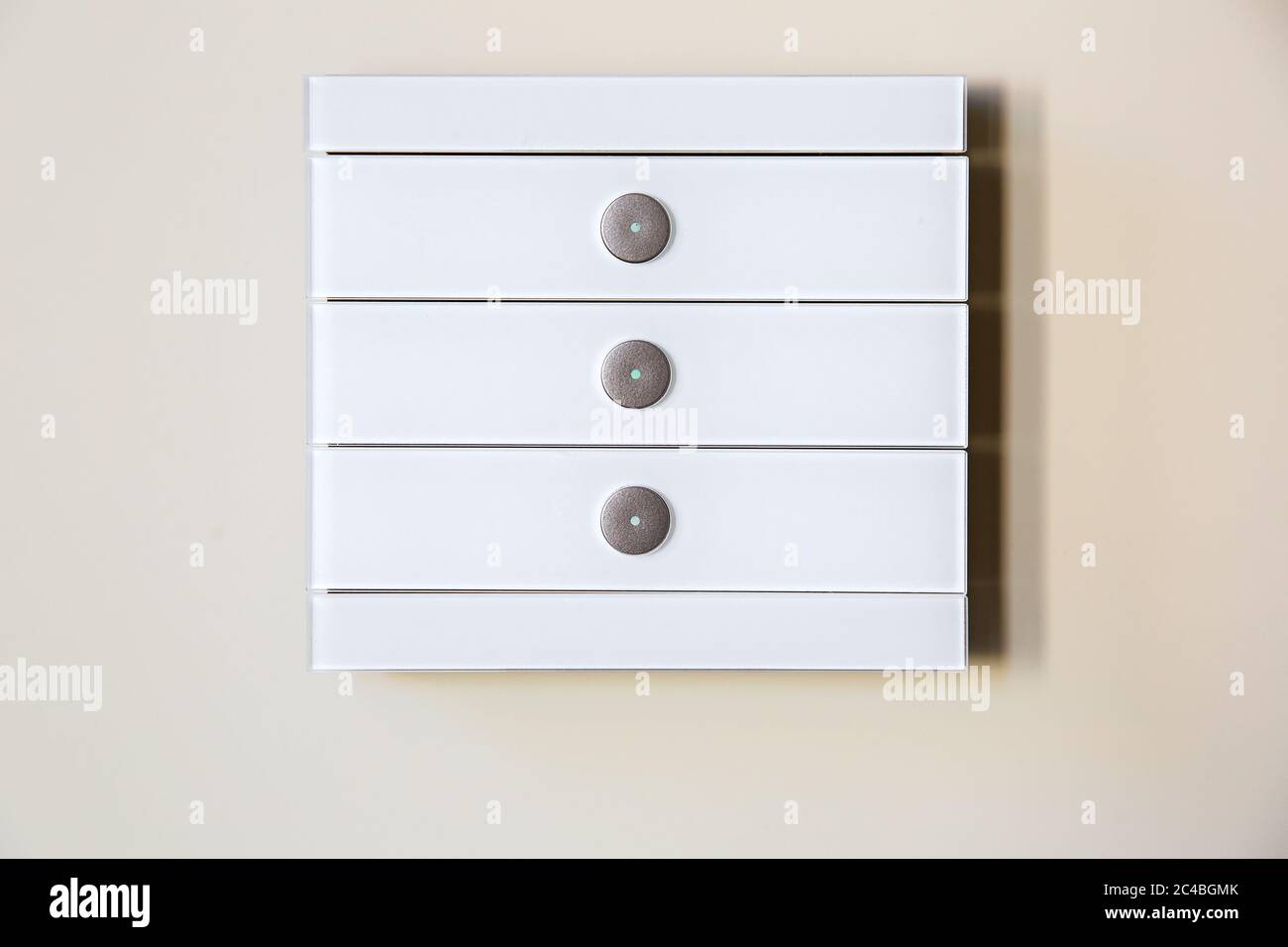 A modern white glass touch sensitive multifunctional light switch with ...
