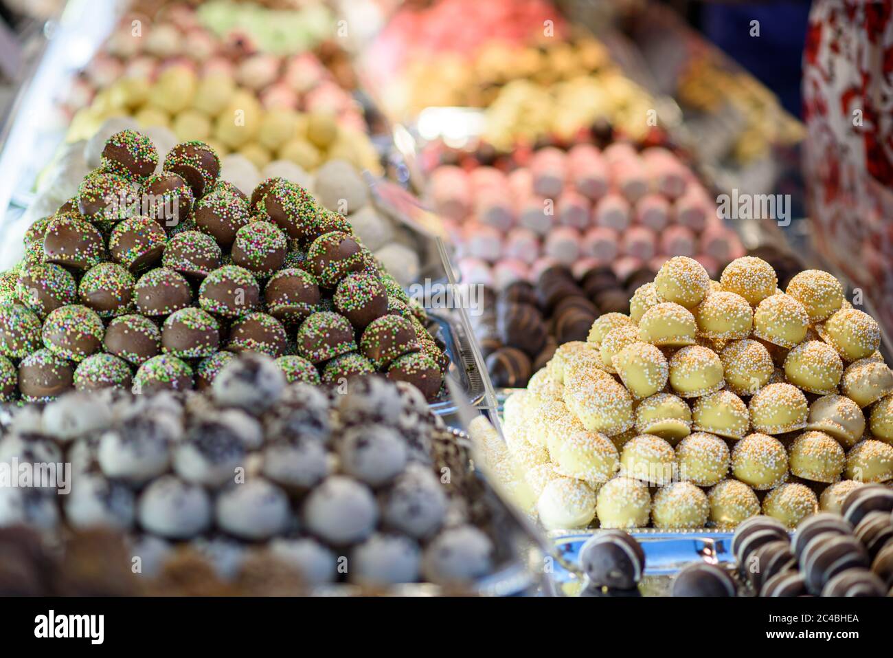 Traditional marzipan candies of different colors and flavors displayed ...