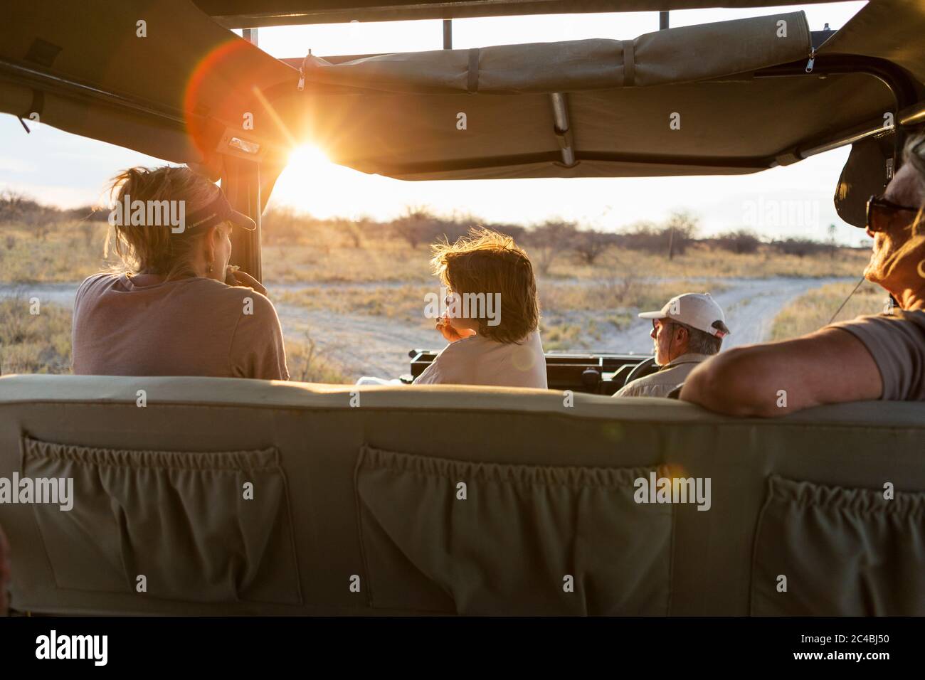 family in safari vehicle, Kalahari Desert, Makgadikgadi Salt Pans ...