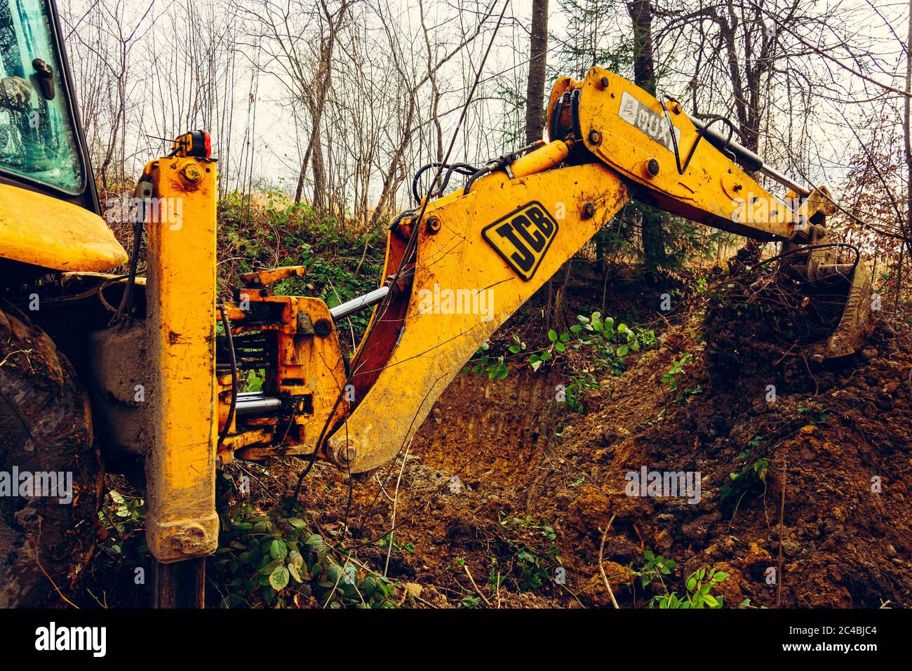 Trostyanets, Ukraine December 20, 2019: excavator digs soil in a ...