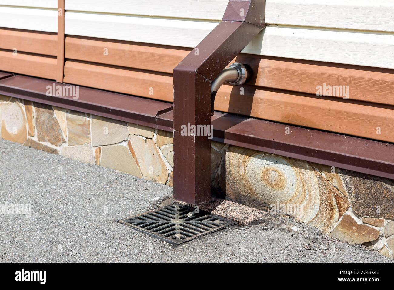 storm system rainwater drain pipe from the roof of the building fixed ...
