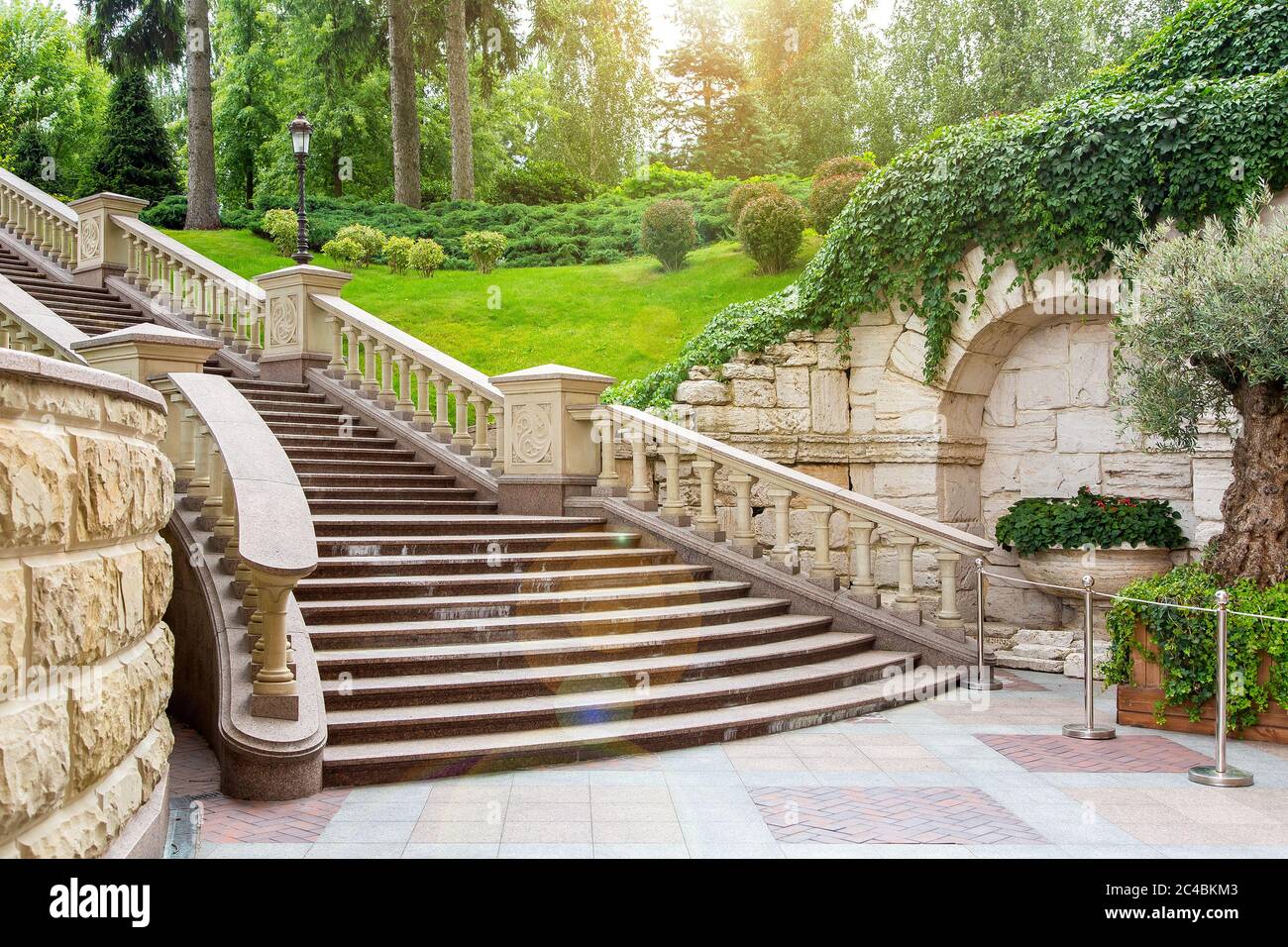 granite staircase with stone railings and balustrades with a wall ...