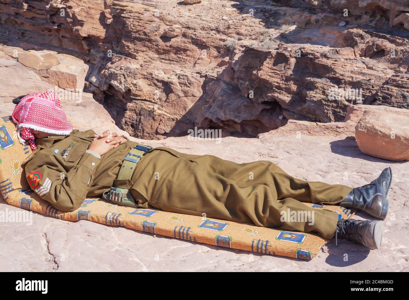 Jordanian soldier sleeping, Ancient Nabatean city Petra, Jordan Stock ...