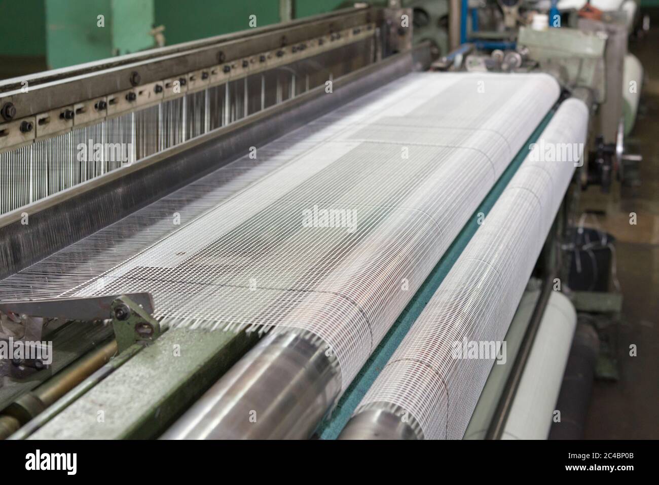 Fiberglass mesh making machine at factory, building materials for wall ...