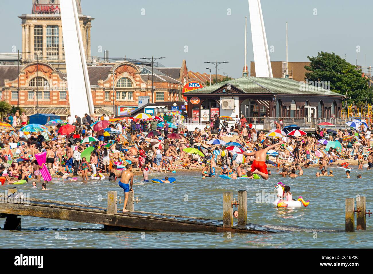Crowded beach and sea. Despite the COVID-19 Coronavirus lockdown crowds ...