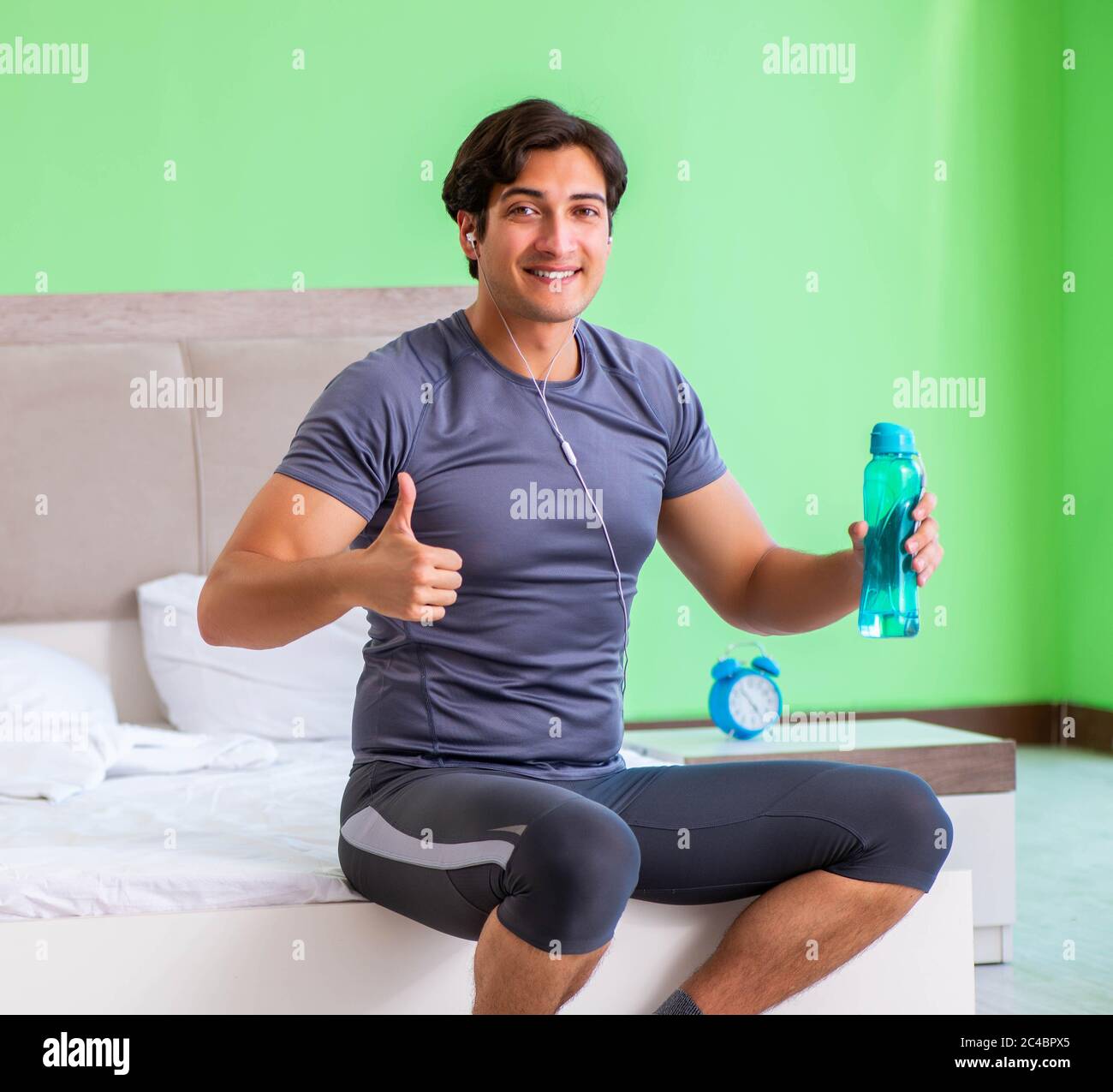 The young handsome man doing morning exercises in the hotel room Stock ...