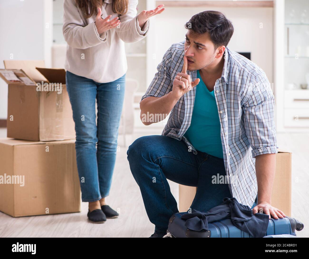 The woman evicting man from house during family conflict Stock Photo ...