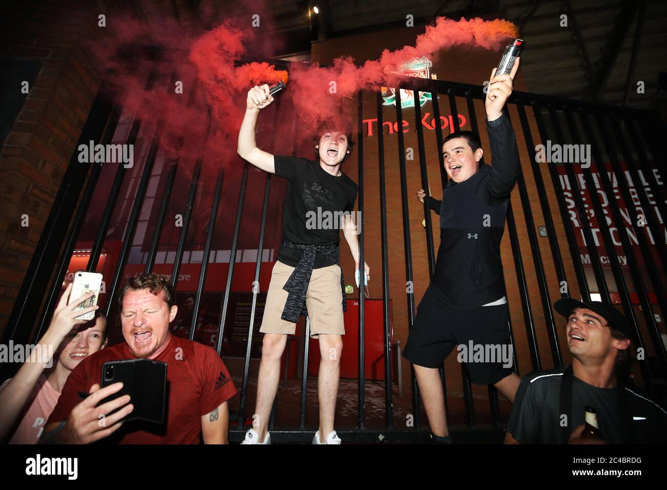 Liverpool fans let off flares outside Anfield, Liverpool Stock Photo ...