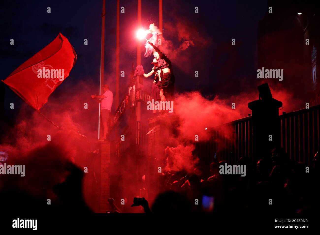 Liverpool fans let off flares outside Anfield, Liverpool Stock Photo ...