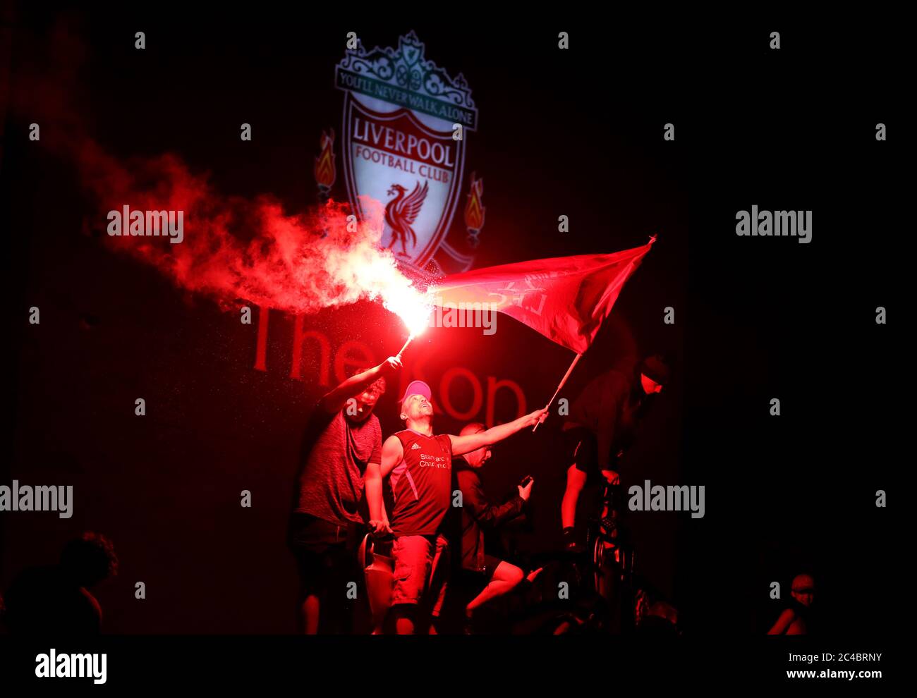 Liverpool fans let off flares outside Anfield, Liverpool Stock Photo ...